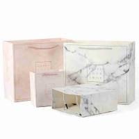 China Personalised CCNB Pantone color Printed Paper Gift Bags For Clothing Jewelry Packaging for sale