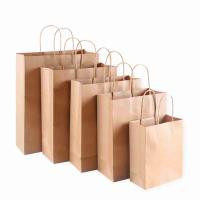 China Wholesale Khaki Color Christmas Kraft Paper Bags For Clothing Packaging for sale