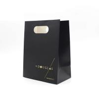 China Custom Print Black Boutique Gold Hot Foil Paper Bag With Die Cut Handles for sale