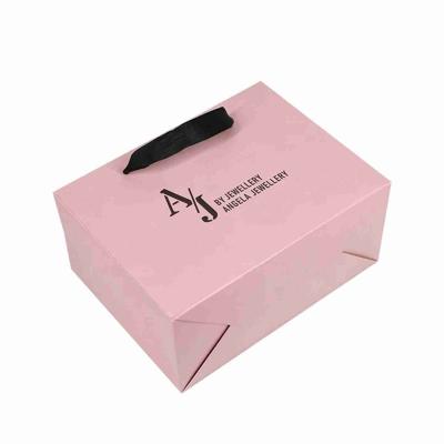 China Eco friendly Pink Souvenir Shopping Bag wedding gift paper bags Custom Offset Printing for sale