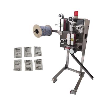 China Automatic Silica Gel Deoxidizer Desiccant Sachet Inseter for Vertical Bagging or Horizontal Packing Machine for sale