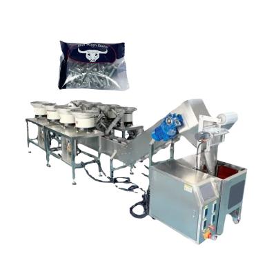 China High Speed Intelligent Vibration Plate Screw Packaging Machine For Screw Nut for sale