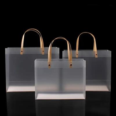 China Soft Loop Handle Pp Plastic Frosted Shopping Tote Bag with Letter Pattern and Rivet for sale