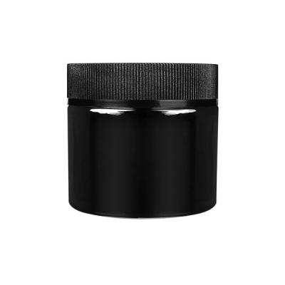 China 2oz Glass Concentrate Jar Flower Packing Black Cap Child Resistant Glass Jars for sale