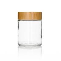 China 2oz 3oz 4oz Wooden Lid Glass Jars Childproof Air Tight Food Storage Containers for sale