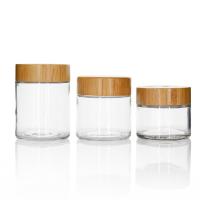 China 2oz 3oz 4oz Wooden Lid Glass Jars Childproof Air Tight Food Storage Containers for sale