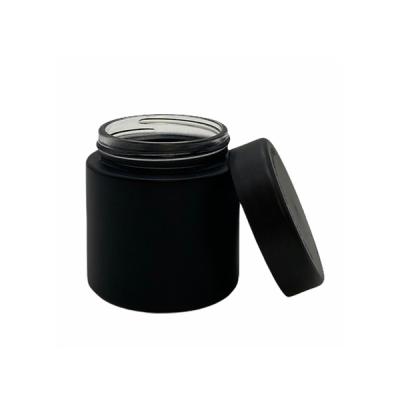 China Flower Matte Black Glass Jars Food Grade Uv Protection 60ml Glass Jars With Lids for sale