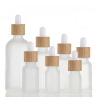 China Boston Round Small Glass Dropper Bottles 30ml 1 Oz Dropper Bottles Child Resistant for sale