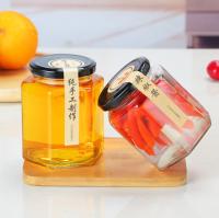 China Transparent Glass Sealed Can Hexagonal Honey Empty Glass Bottles 13oz 4oz 6oz 10oz for sale
