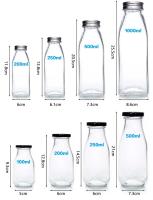China Round Screen Printing Milk Beverage Empty Glass Bottles 200ml 250ml 500ml 1000ml With Cap for sale