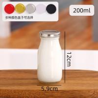 China Round Screen Printing Milk Beverage Empty Glass Bottles 200ml 250ml 500ml 1000ml With Cap for sale
