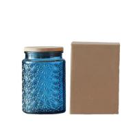 China Embossed Colored 700ml Glass Sealed Jar Household Kitchen Storage Container With Lid for sale