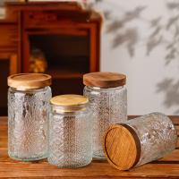 China Retro Embossed 500ml 1L Square Airtight Storage Jar Sealed Glass Container With Acacia Wooden Lid for sale