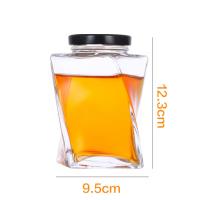 China 360ml Custom Clear Twist Shape Honey Glass Bottle Unique Honey Jars With Metal Cap for sale