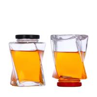 China 360ml Custom Clear Twist Shape Honey Glass Bottle Unique Honey Jars With Metal Cap for sale