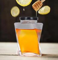 China 360ml Custom Clear Twist Shape Honey Glass Bottle Unique Honey Jars With Metal Cap for sale