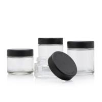 China 3oz Child Resistant Glass Jars With Black Caps for sale