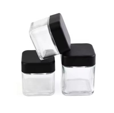 China Empty Smell Proof Child Resistant Container 60ml Child Proof Square Glass Jar With CRC Lid for sale