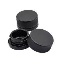 China 5ml 7ml 9ml Black Child Resistant Concentrate Glass Jar Mini Cream Bottles Cosmetic Black Containers Jars With Lid for sale