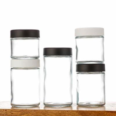 China Customized Printing 1oz 2oz 3oz 4oz Clear Childproof Glass Jars 3 Oz Jar Straight Sided Glass Child Resistant Cap Cr Jar for sale