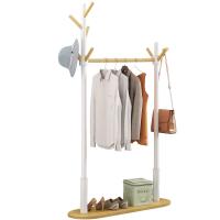 China Bedroom Bamboo Frame Coat Rack Hanger Stand With Laundry Basket for sale