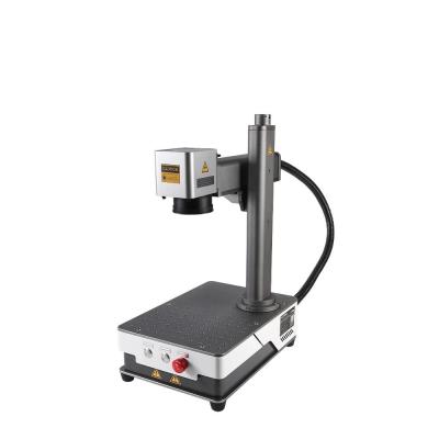 China 20W Portable Fiber Laser Marking Machine with Rotary Worktable and Water Cooling for sale