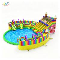 China Colorful Sweets Theme Inflatable Playground Outdoor Water Park with Double Lane Slide and Round Pool for Amusement for sale