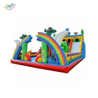 China Commercial Grade Inflatable Dinosaur Playground With Slides Rainbow Bouncer Castle Kids Party Rental Adventure Park for sale