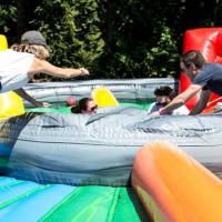China Commercial Sport Center New Large Inflatable Human Hungry Hippos Game Interactive Bungee Jumper Blow Up Bouncer for Carnival Party Rental Event Team Building Activities for sale