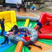 China Commercial Sport Center New Large Inflatable Human Hungry Hippos Game Interactive Bungee Jumper Blow Up Bouncer for Carnival Party Rental Event Team Building Activities for sale