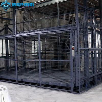 China 10m High Black 500kg-20000kg Industrial Indoor Goods Lift Hydraulic Cargo Elevator for sale