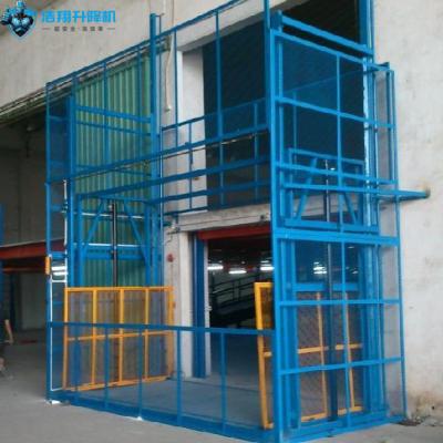China 6m High Blue 500kg-20000kg Industrial Indoor Goods Lift Hydraulic Cargo Elevator for sale