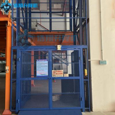 China 6m High Customizable Blue 500kg-20000kg Industrial Indoor Hydraulic Freight Lift for sale