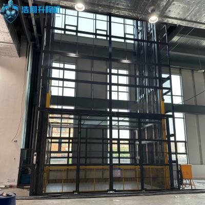 China 4 Fold Door And Counterweight Door 8 Tons 10M High Large Capacity Industrial Indoor Hydraulic Freight Lift for sale