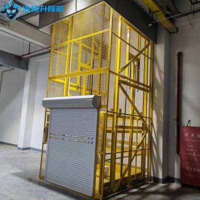 China Yellow Rolling Door Platform Warehouse Cargo Elevator Steel Heavy Loads Hydraulic Lifts for sale
