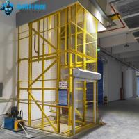 China Yellow Rolling Door Platform Warehouse Cargo Elevator Steel Heavy Loads Hydraulic Lifts for sale