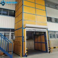 China Customized Yellow Perforated Metal Protection Net Rolling Door Indoor Platform Warehouse Cargo Elevator Steel Heavy Loads Hydraulic Lifts for sale