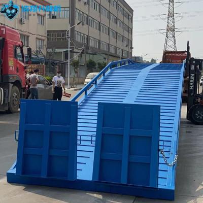 China Steel Bars Large Load Capacity Conventional  Blue Hydraulic Dock Ramp In Warehouse And Factory for sale