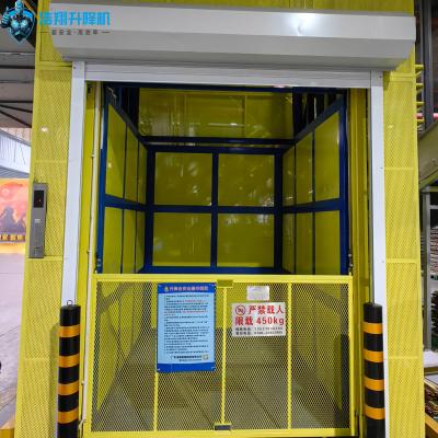 China Perforated Metal Protective Net And Counterweight And Rolling Door 5 m Warehouse Cargo Elevator Steel Indoor Hydraulic Lifts Loading Heavy Freight for sale