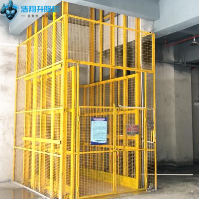China Customized Yellow 2 Floors 8m Warehouse Loading And Unloading Heavy Freight Cargo Elevator Steel Indoor Hydraulic Lifts for sale