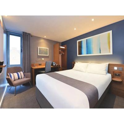 China Modern Hotel Bedroom Furniture Travelodge Wholesale Liquidation Wardrobe Bed Base Headboard Chairs Sofa Panel for Guest Room for sale