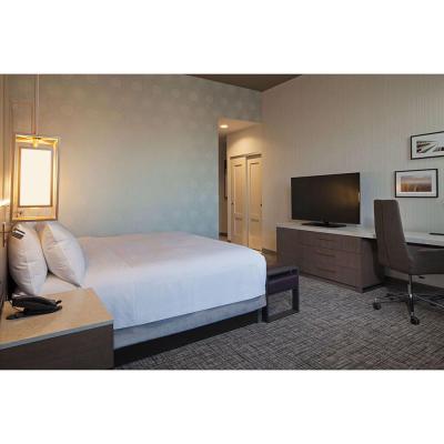 China Curio Custom Modern Hotel Bedroom Set Guest Room Wardrobe Bed Base Headboard Chairs Sofa Liquidation Hotel Bedroom Furniture for sale