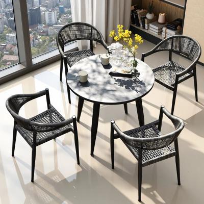 China Hot Sell Woven Rope Rattan Outdoor Stackable Wholesale Iron Frame Metal Patio Garden Dining Chair with Waterproof Cushion for sale