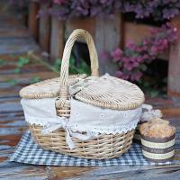 China Picnic Fruit Storage Basket With Cover Rattan Wicker Basket Easter Family Snack Container Multifunctional Hand-woven Basket for sale
