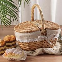 China Picnic Fruit Storage Basket With Cover Rattan Wicker Basket Easter Family Snack Container Multifunctional Hand-woven Basket for sale