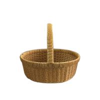 China Handmade Pastoral Large Oval Rattan Woven Storage Basket Kitchen Storage And Organization Accessories for sale