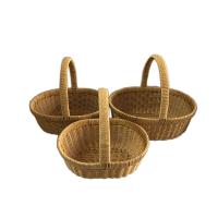 China Handmade Pastoral Large Oval Rattan Woven Storage Basket Kitchen Storage And Organization Accessories for sale