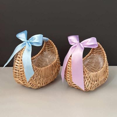China Handwoven Picnic Fruit Basket With Ribbon Half Moon Rattan Storage Basket With Handle For Party Wedding Decor Flowers Container for sale