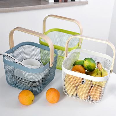 China Metal Mesh Weave Storage Organizer Basket Multi-functional Hanging Kitchen Fruit Basket with Wood Handle for sale