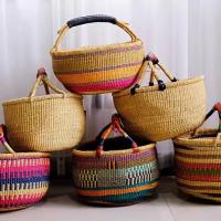 China Natural Straw Wicker Woven Round Seagrass Bolga Baskets Cheapest Wholesale Uk Clothing Organizer Storage Handmade Craft for sale